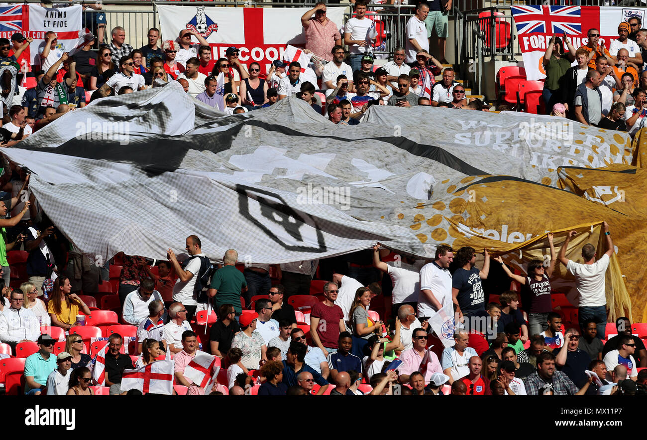 Fans display a banner showing their support for Nigeria and ...