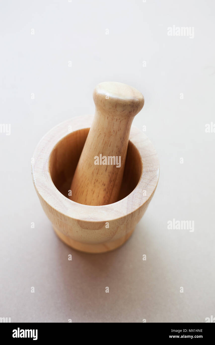 Brown wooden mortar on white background Stock Photo - Alamy