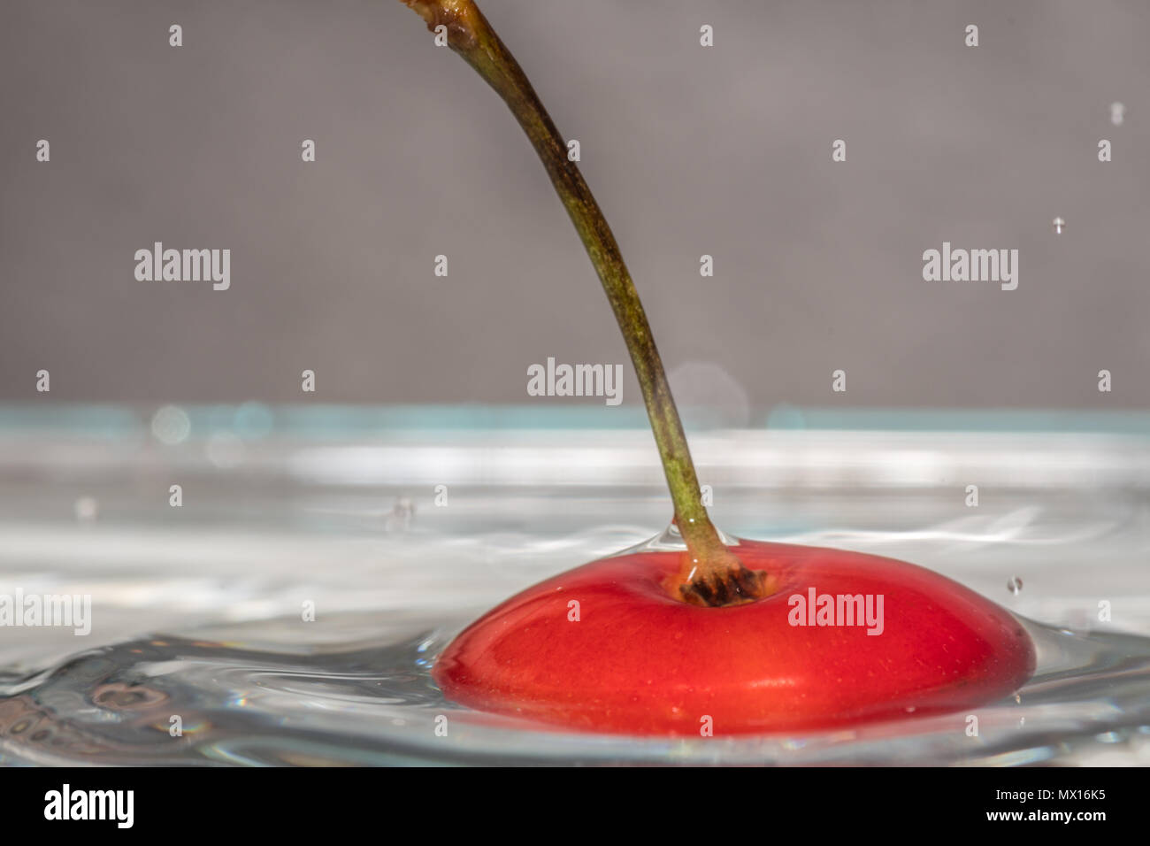 Cherry water splash hi-res stock photography and images - Alamy