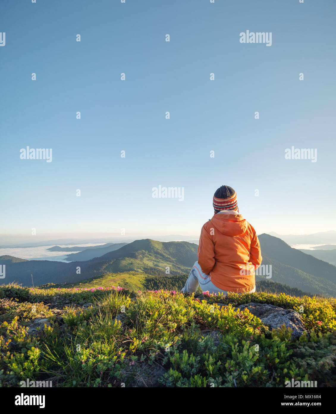 Tourist relax on the mountain top. Sport and active life concept Stock ...