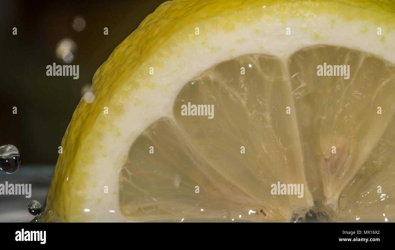 Isolated macro of a lemon slice in water background Stock Photo - Alamy