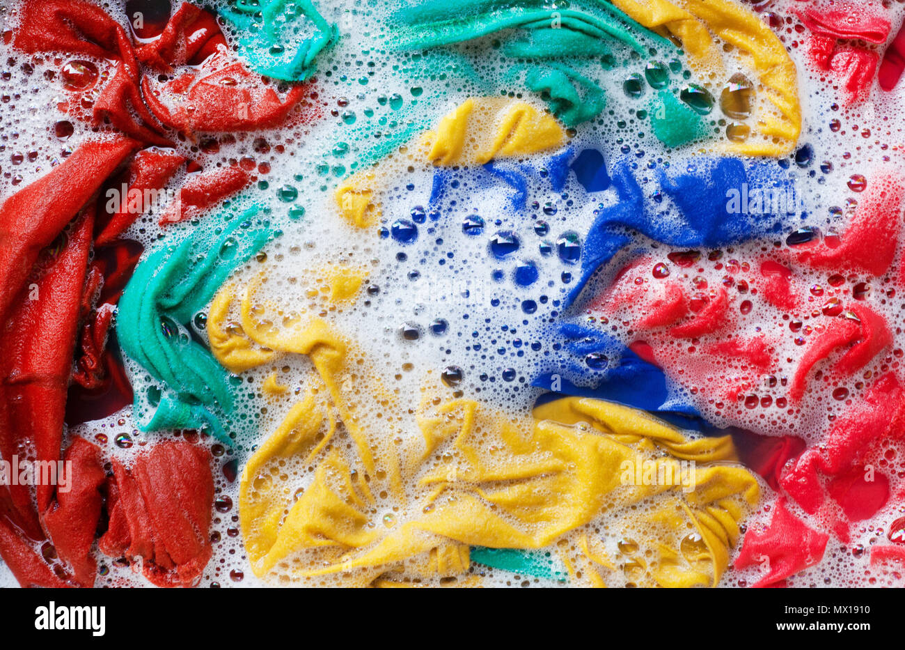 Soak a cloth before washing, Color clothes Stock Photo - Alamy