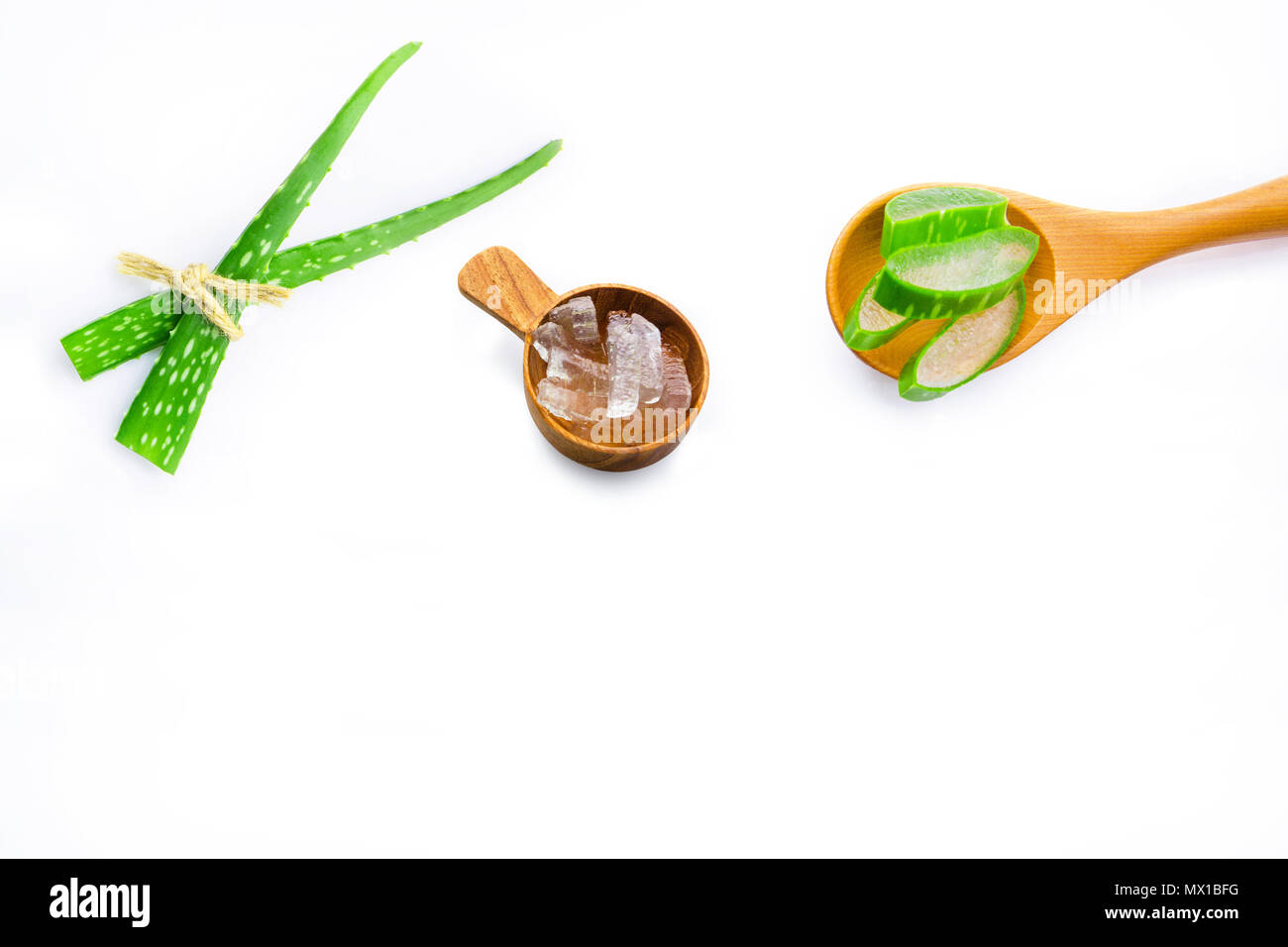 Aloe vera fresh leaves with aloe vera gel on wooden spoon. isolated on ...