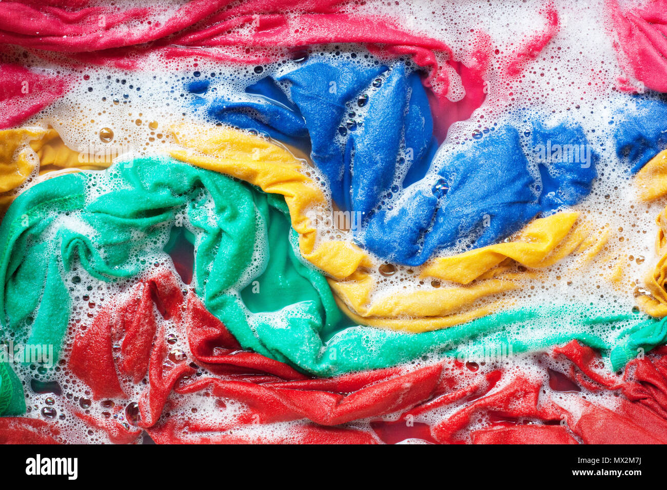 Soak a cloth before washing, Color clothes Stock Photo - Alamy
