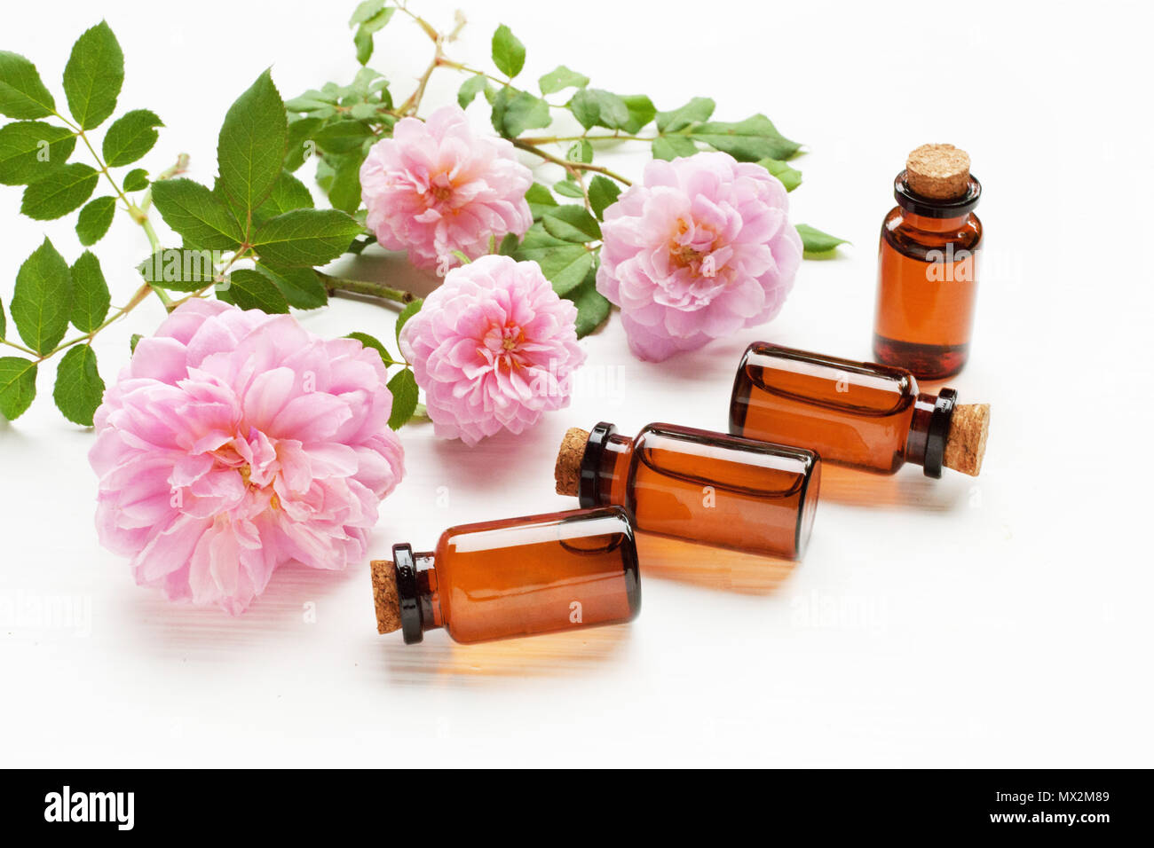 Bottles of essential rose oil for aromatherapy, Huntington Rose Stock ...