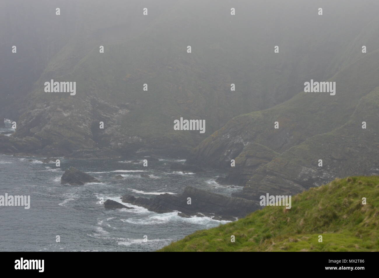 Landscape of cliffs covered in fog Stock Photo - Alamy