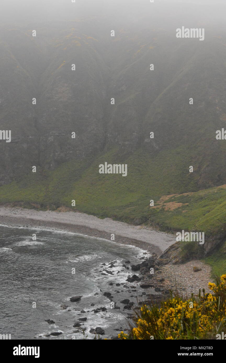 Landscape of cliffs covered in fog Stock Photo - Alamy