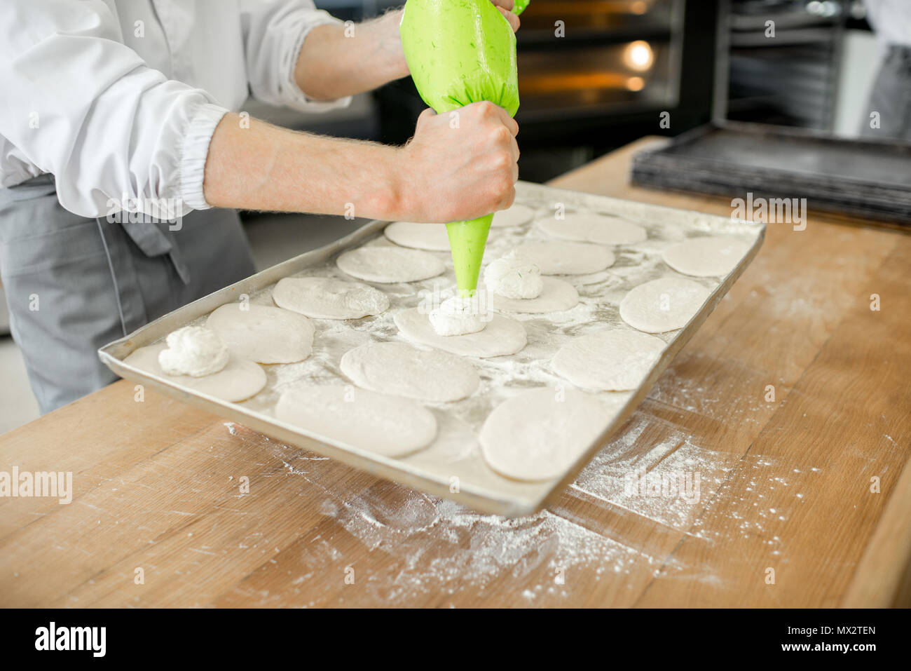 Filling buns at the manufacturing Stock Photo - Alamy