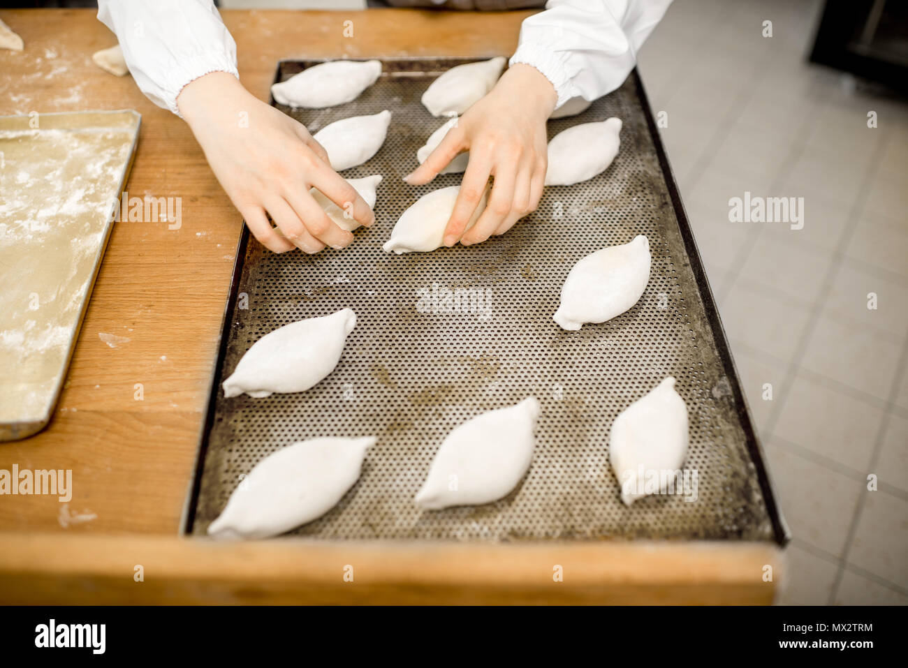 Forming buns at the manufacturing Stock Photo - Alamy