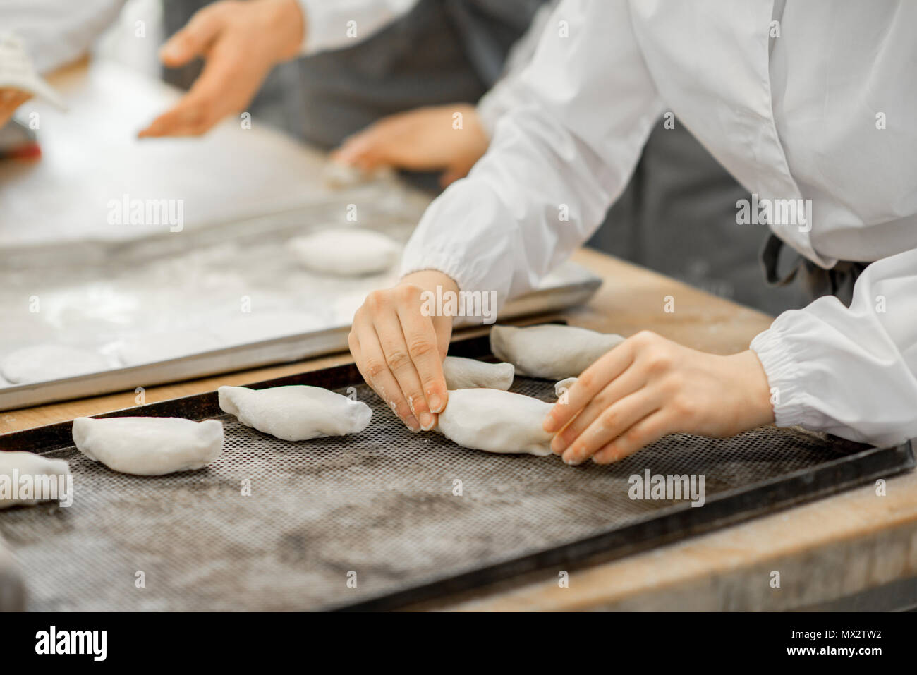 Forming buns at the manufacturing Stock Photo - Alamy