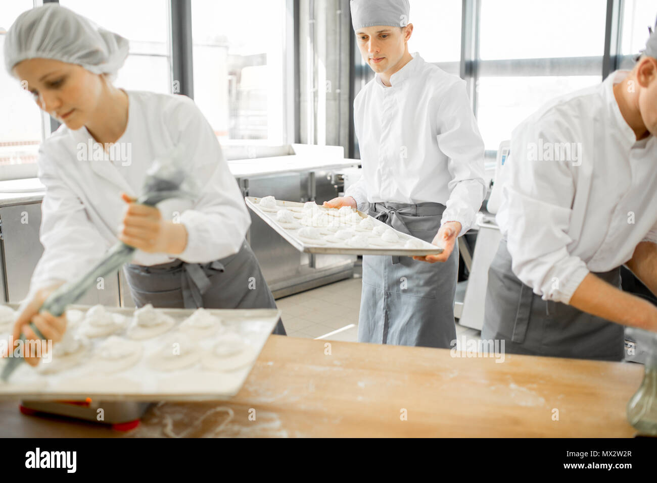 Bakers making buns at the manufacturing Stock Photo - Alamy