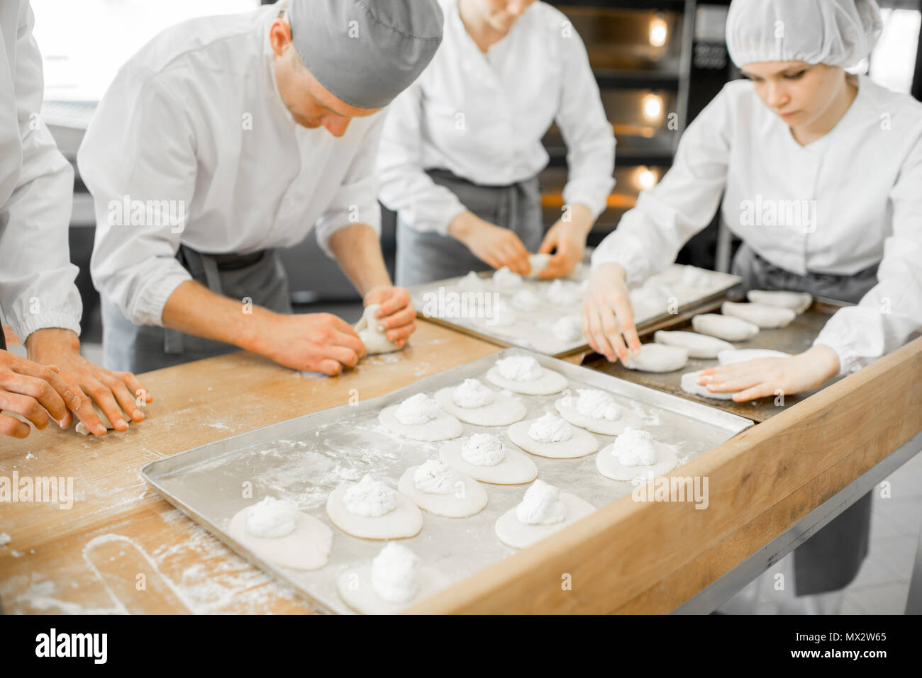 Bakers making buns at the manufacturing Stock Photo - Alamy