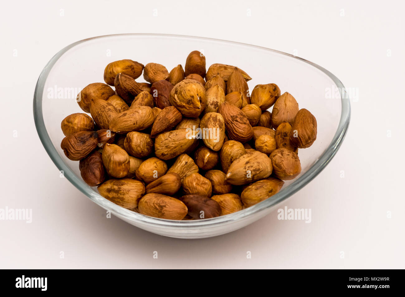 Pile of pealed hazelnuts in the glass bowl Stock Photo - Alamy