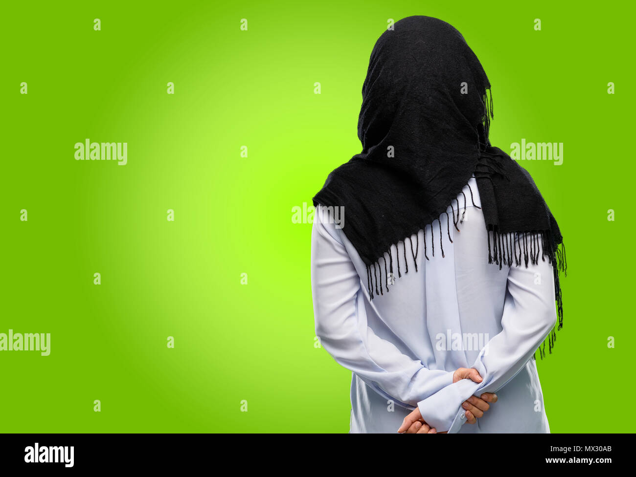 Young arab woman wearing hijab backside, rear view Stock Photo - Alamy