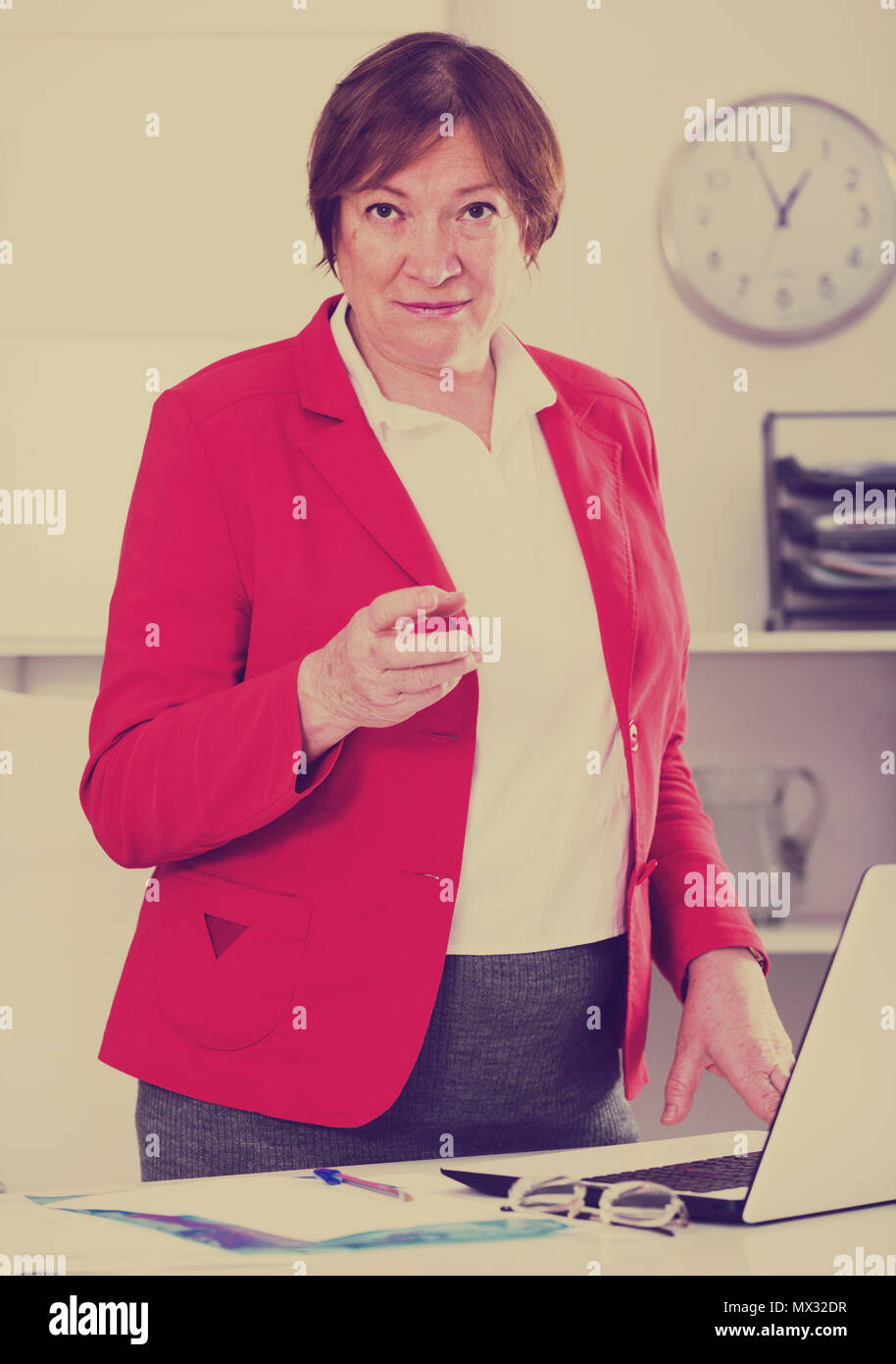 Smiling woman manager waiting for clients in her office Stock Photo - Alamy