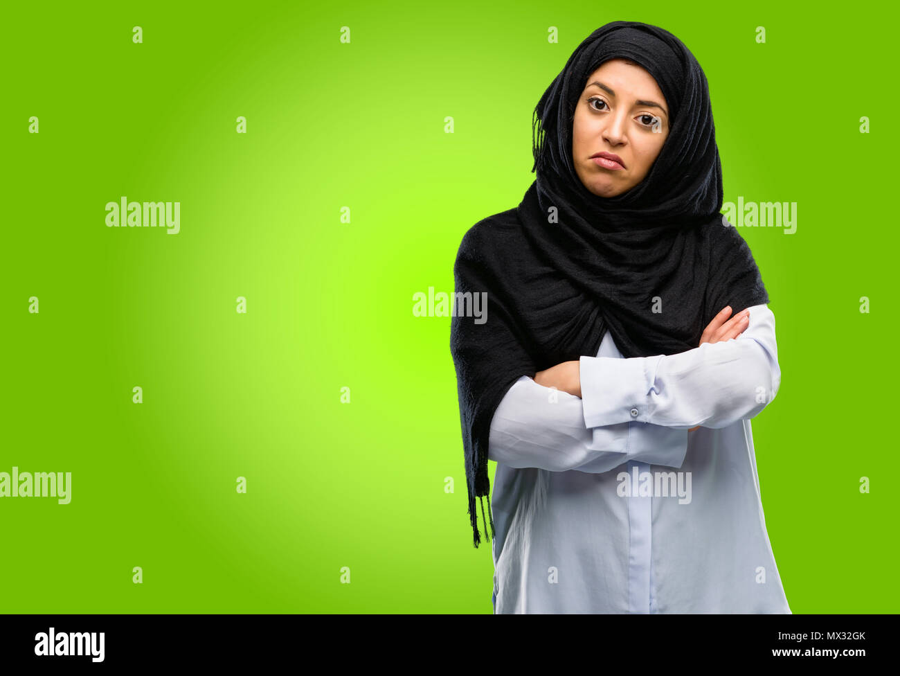 Young arab woman wearing hijab with crossed arms confident and happy ...