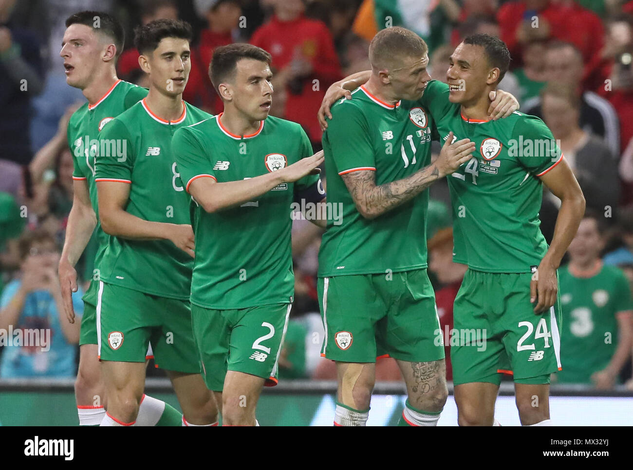 Republic of Ireland's Graham Burke (right) celebrates scoring his side ...