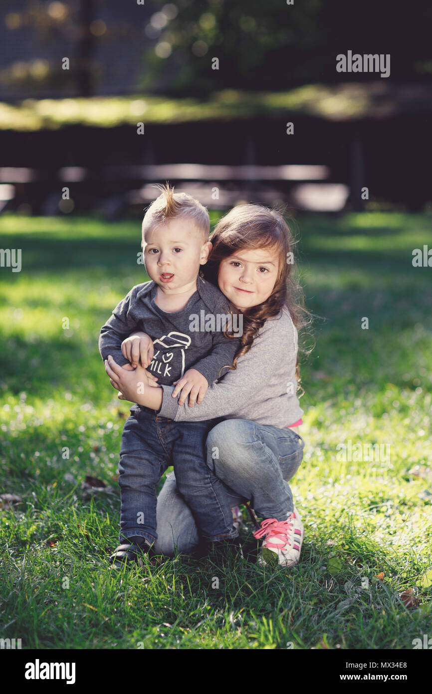 Happiness boy and girl fun outdoor under sunlight Stock Photo - Alamy