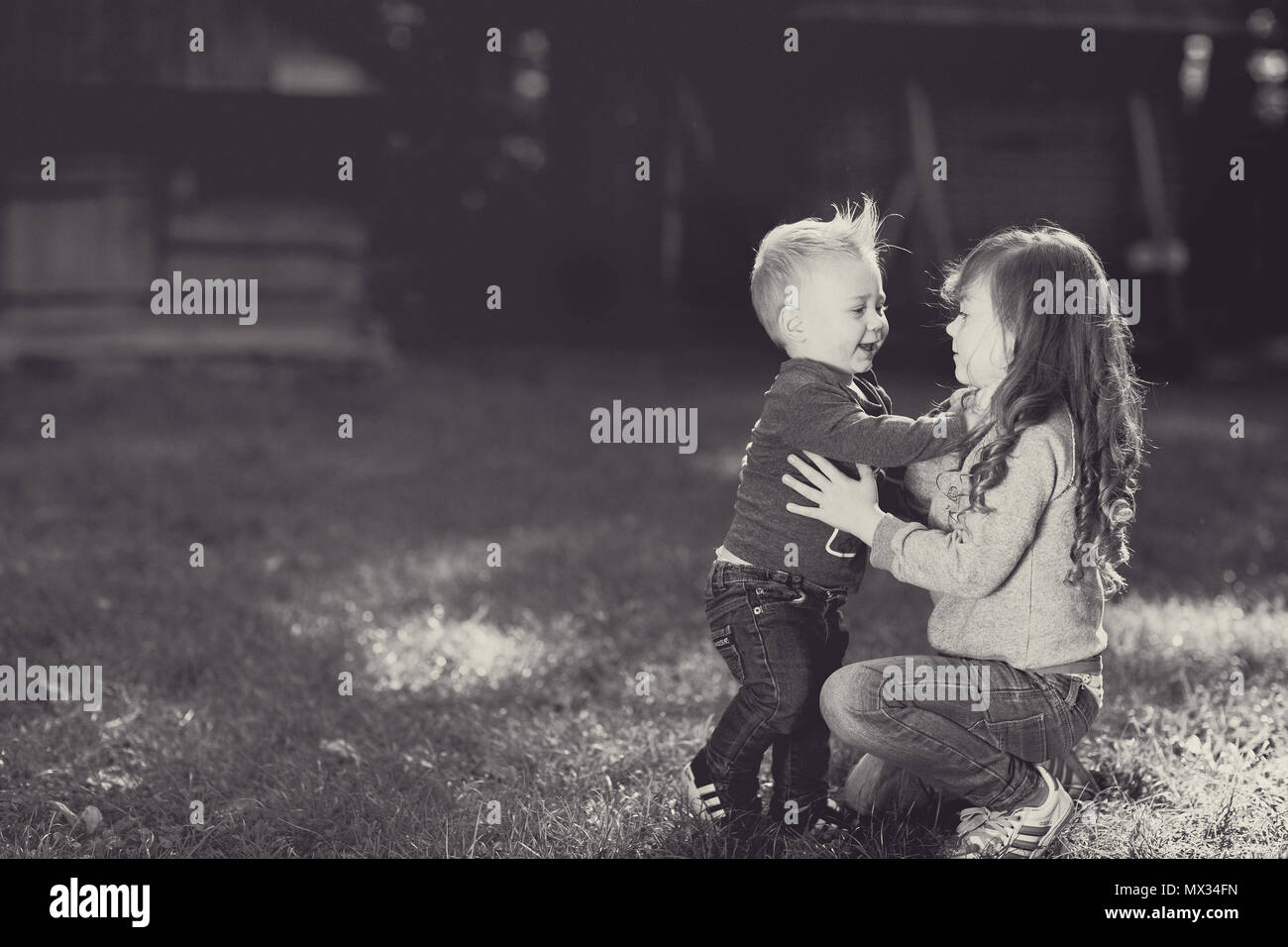 Happiness boy and girl fun outdoor under sunlight Stock Photo - Alamy