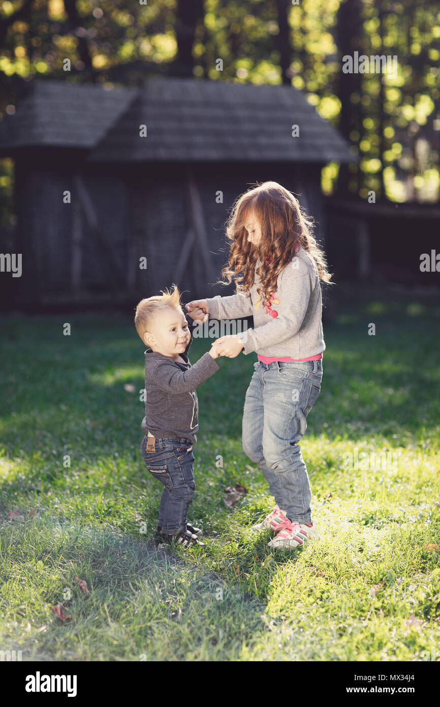 Happiness boy and girl fun outdoor under sunlight Stock Photo - Alamy