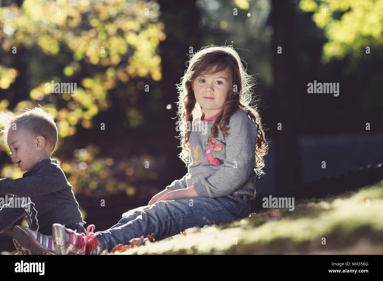 Happiness boy and girl fun outdoor under sunlight Stock Photo - Alamy