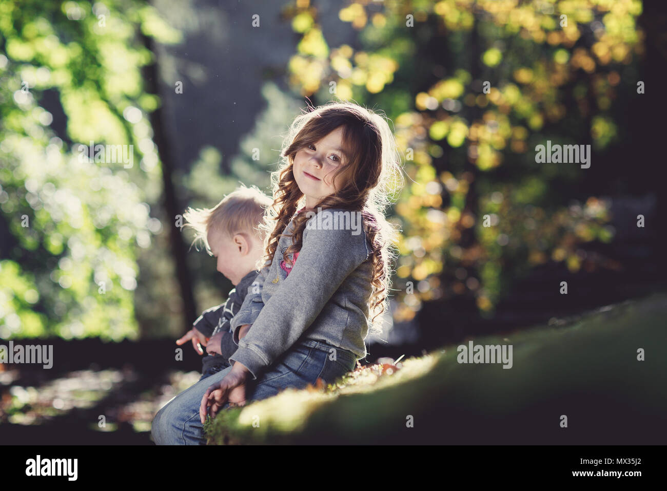 Happiness boy and girl fun outdoor under sunlight Stock Photo - Alamy