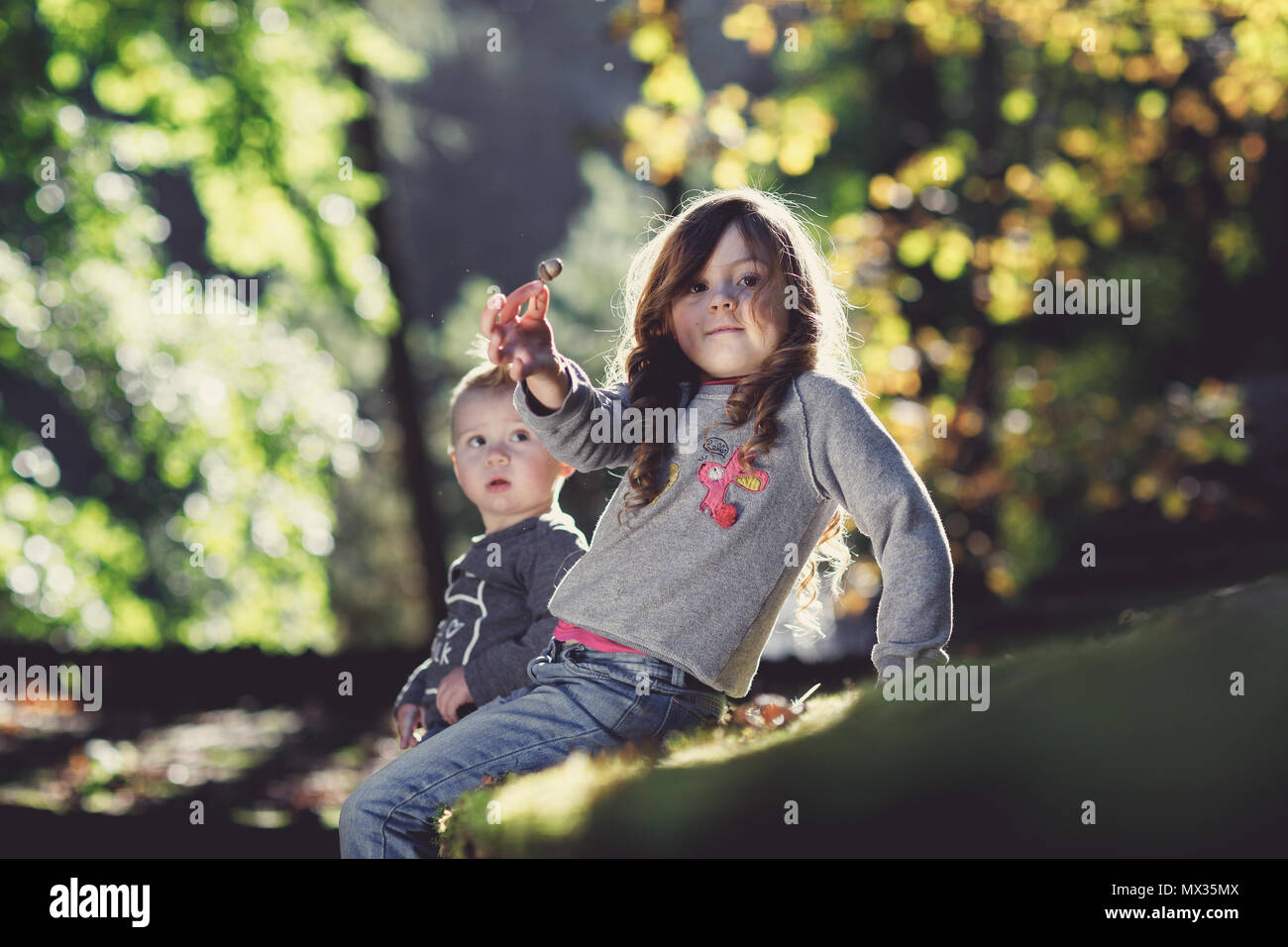 Happiness boy and girl fun outdoor under sunlight Stock Photo - Alamy