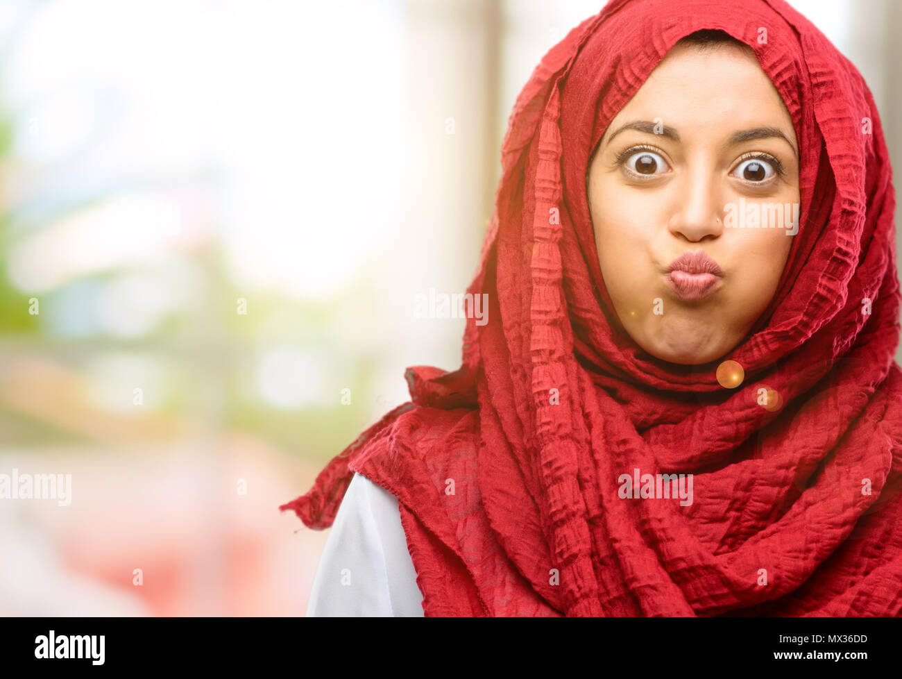 Puffing out cheeks hi-res stock photography and images - Alamy