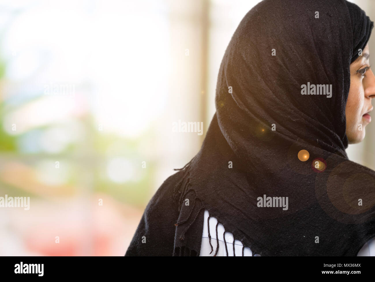 Young arab woman wearing hijab backside, rear view Stock Photo - Alamy