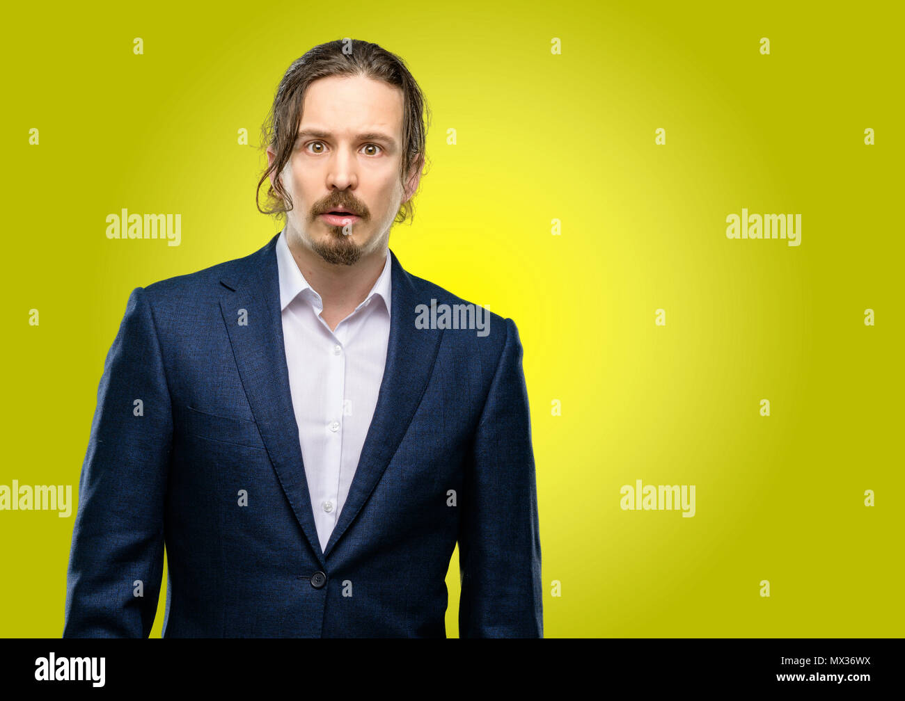 Handsome young man scared in shock, expressing panic and fear Stock ...