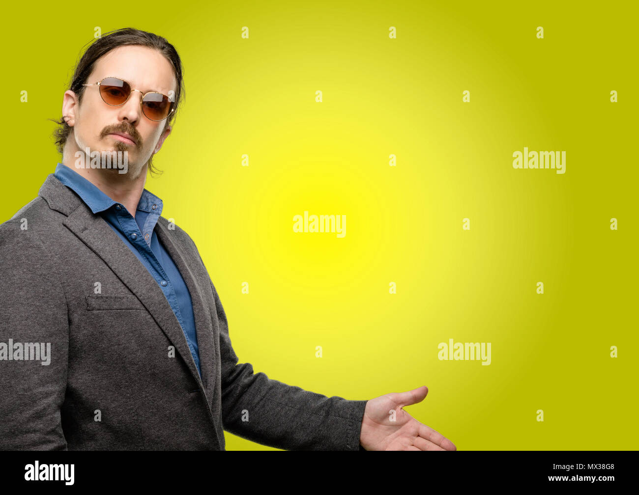 Handsome young man confident and happy with a big natural smile ...