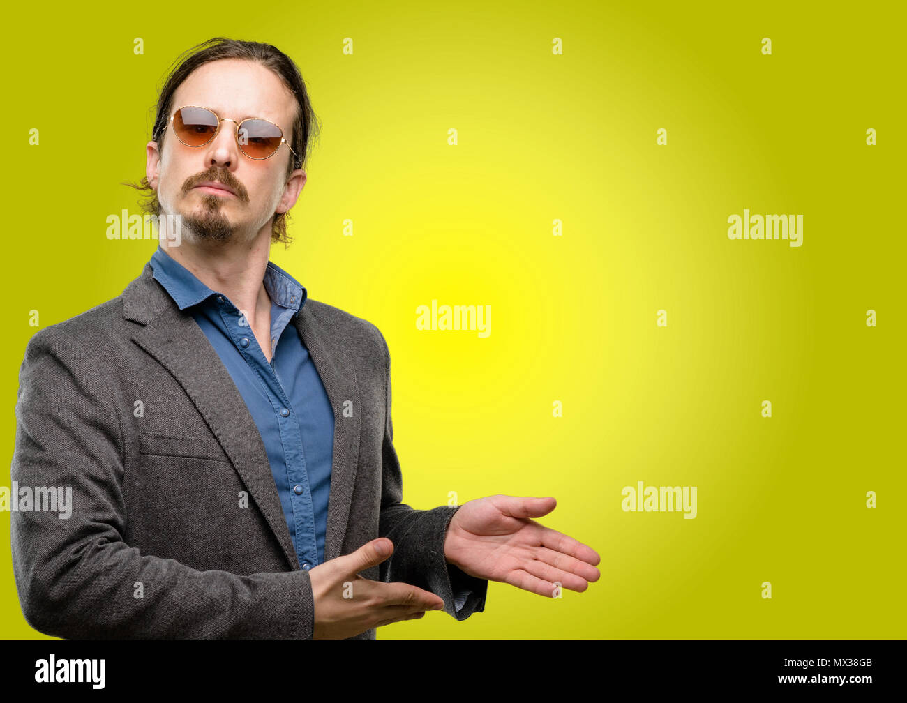 Handsome young man confident and happy with a big natural smile ...