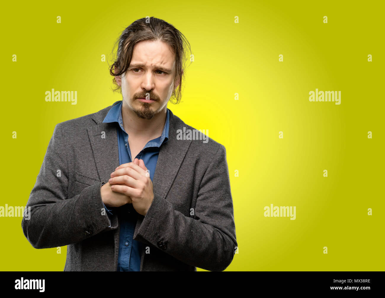 Handsome young man crying depressed full of sadness expressing sad ...