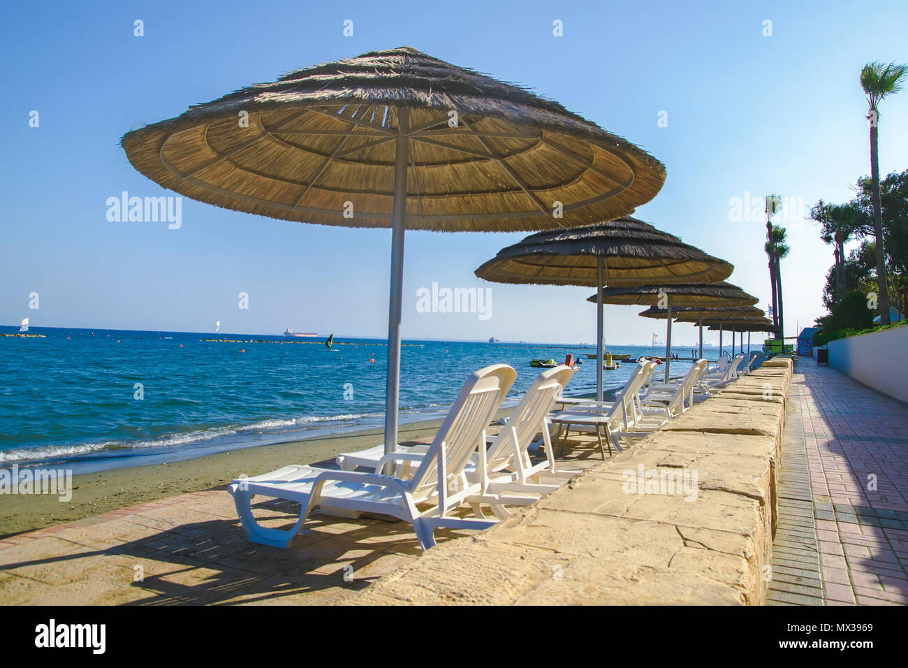 Sandy beach umbrellas sunbeds hi-res stock photography and images - Alamy