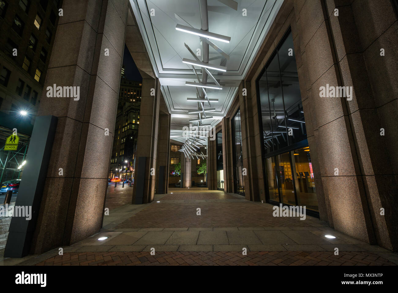 Modern exterior corridor at night, in the Financial District, Manhattan ...
