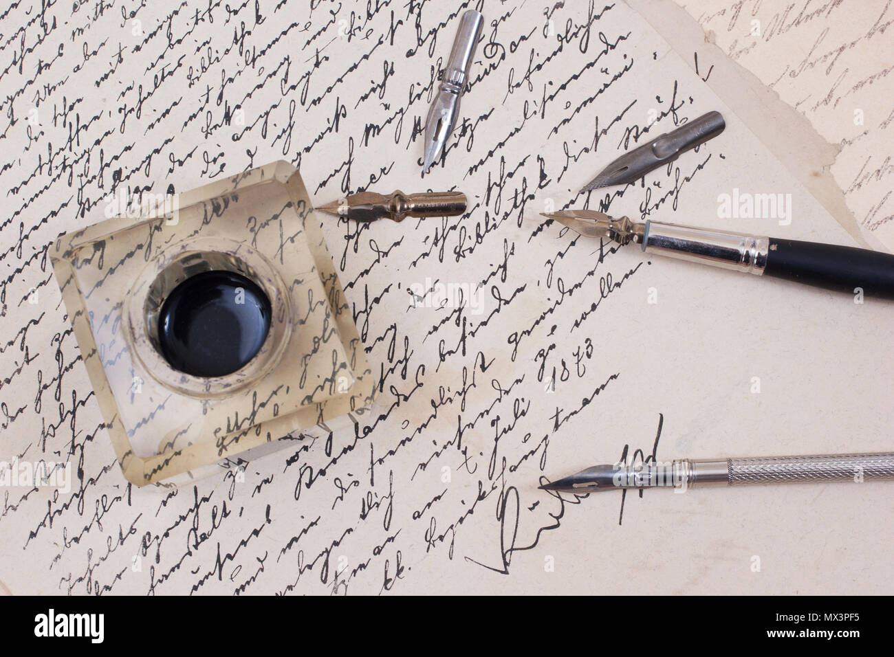 retro ink pen on old aged paper isolated on white Stock Photo - Alamy
