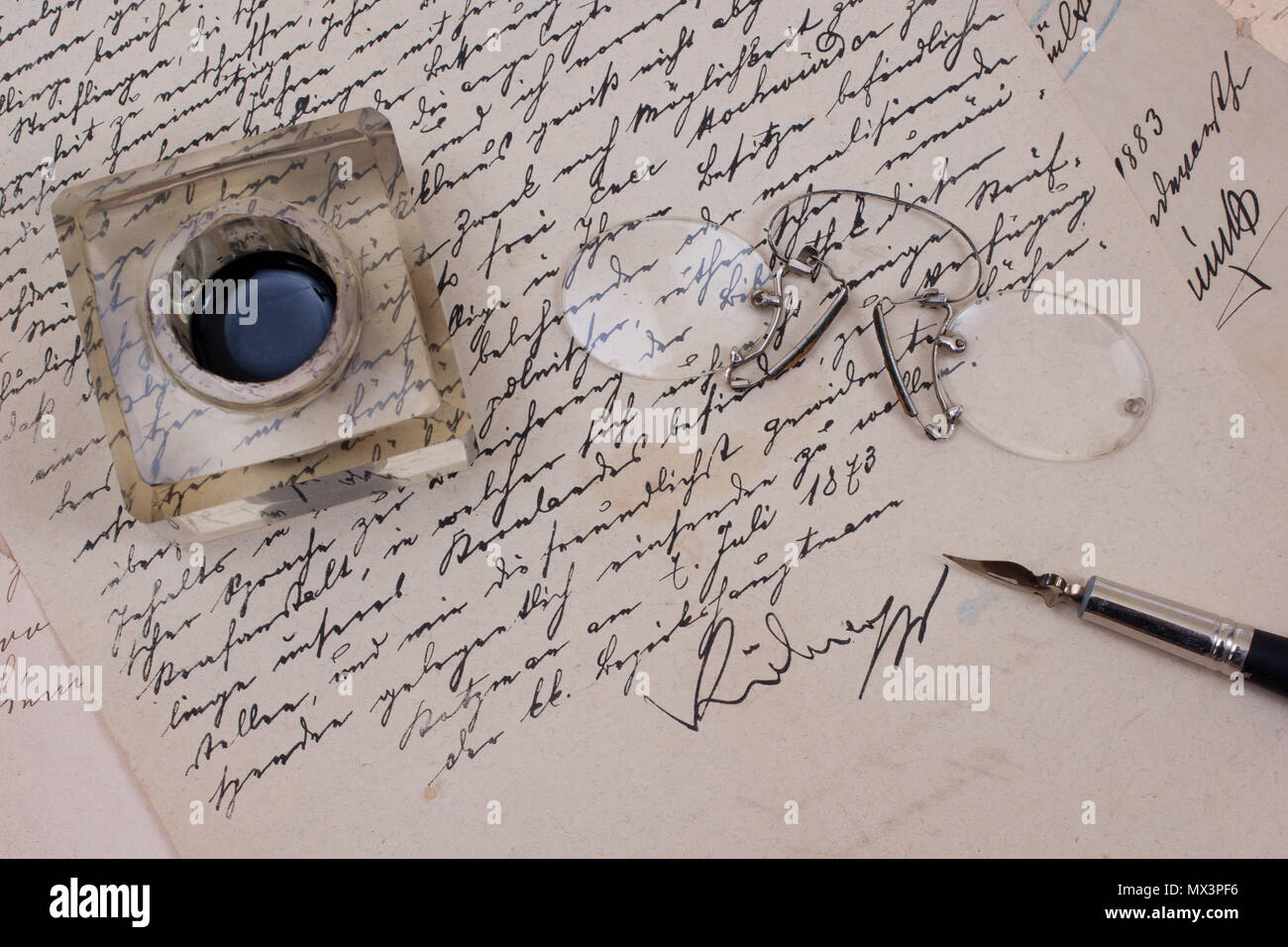 vintage background with retro ink pen on old aged handwriteln letter ...