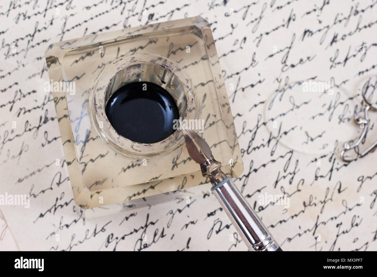 vintage background with retro ink pen on old aged handwriteln letter ...