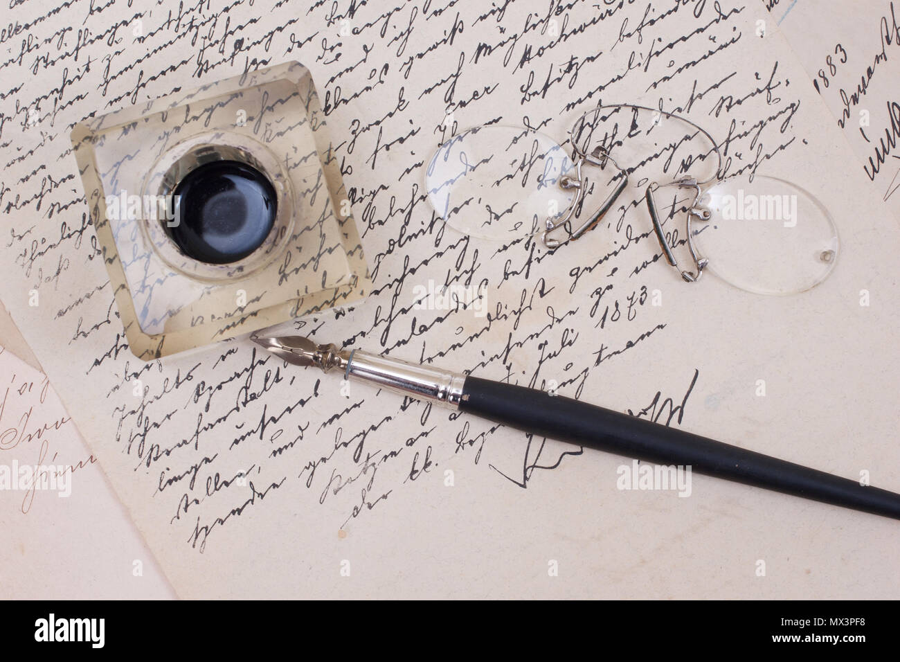 retro ink pen on old aged paper isolated on white Stock Photo - Alamy