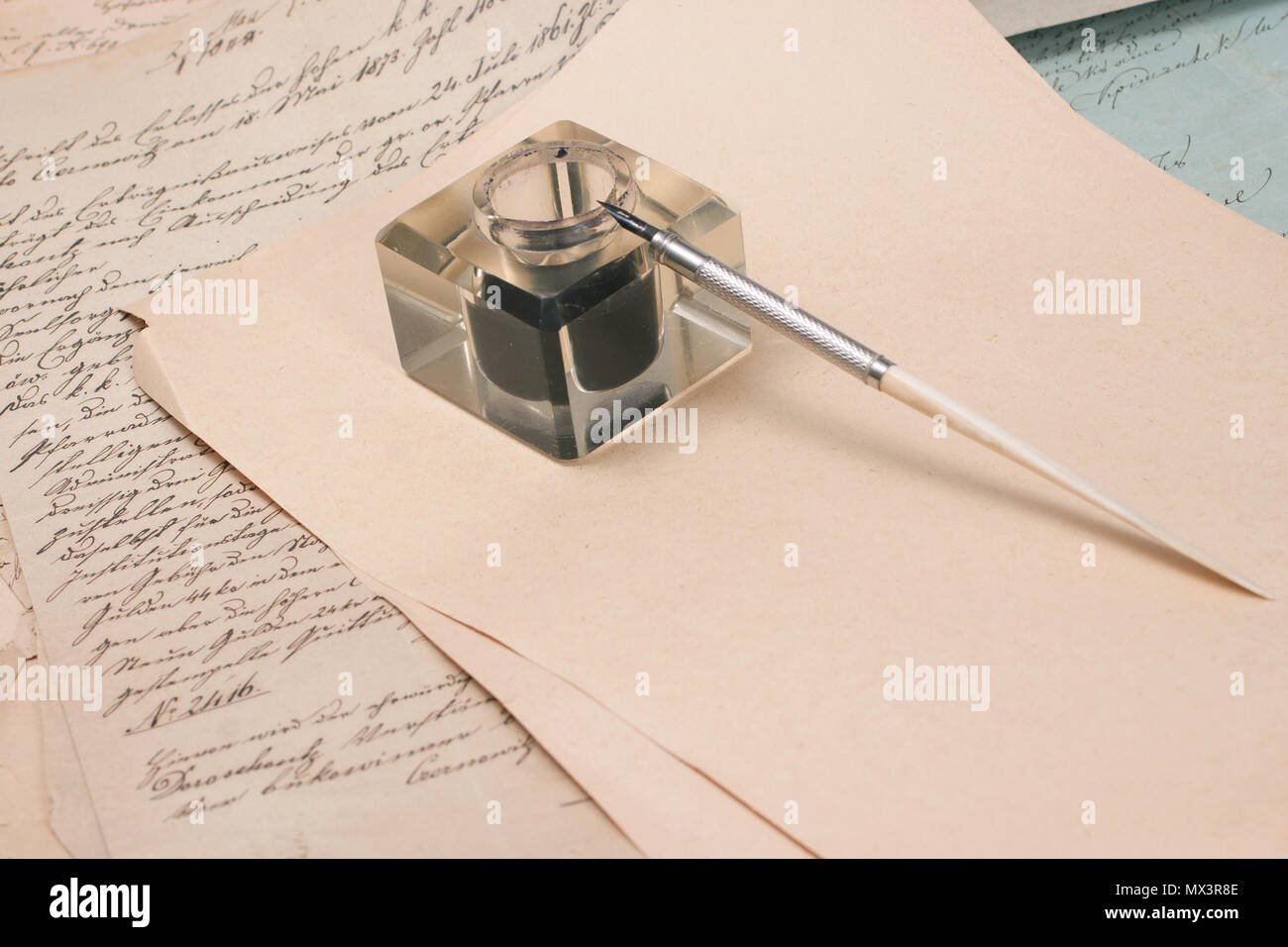 Vintage background with old paper, old ink pen, handwrite letters and ...