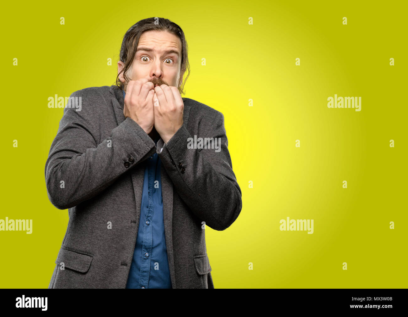 Handsome young man terrified and nervous expressing anxiety and panic gesture, overwhelmed Stock ...