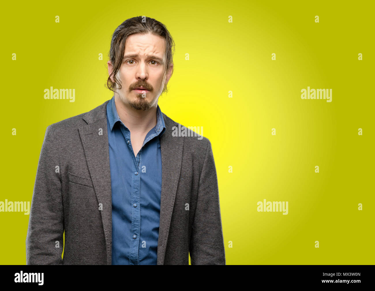 Handsome young man crying depressed full of sadness expressing sad ...