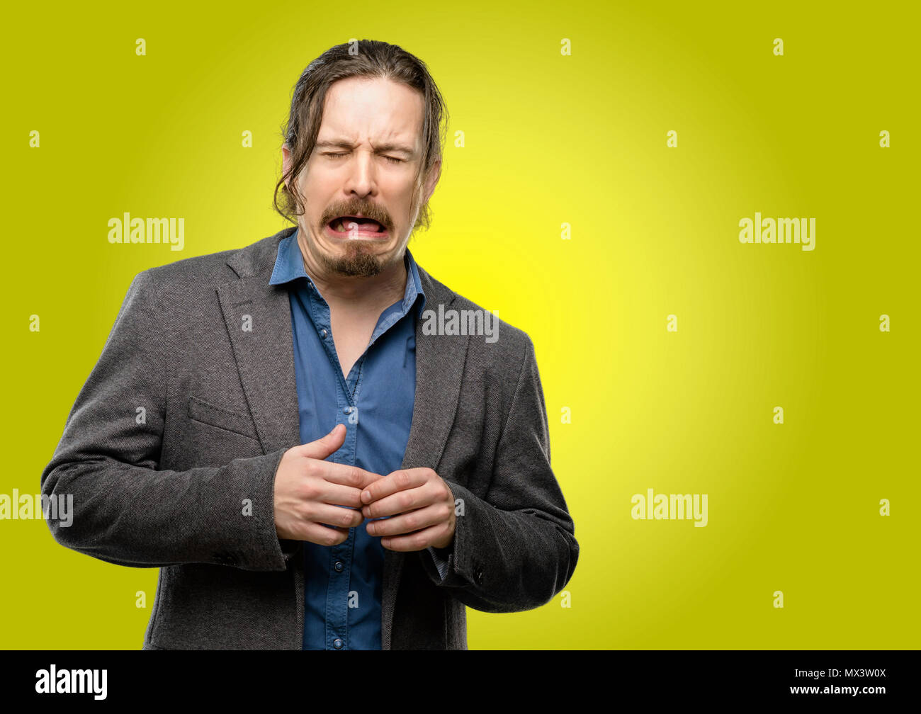 Handsome young man crying depressed full of sadness expressing sad ...