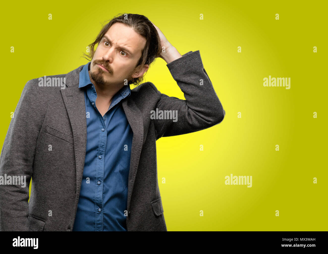 Handsome young man doubt expression, confuse and wonder concept ...