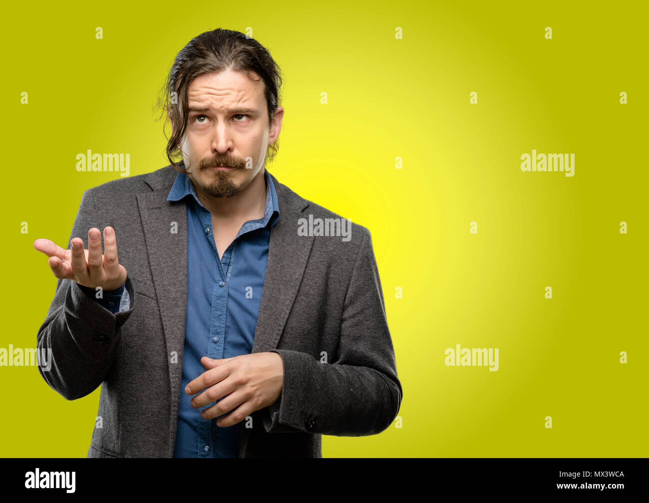 Handsome young man doubt expression, confuse and wonder concept ...