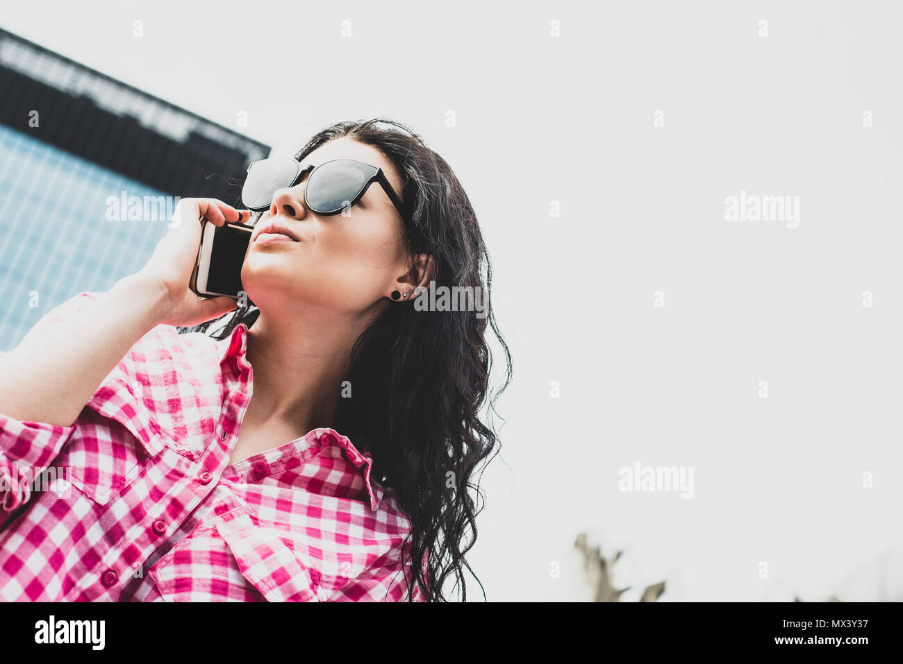 Attractive spontaneous woman talking on the phone. Authenticity and ...