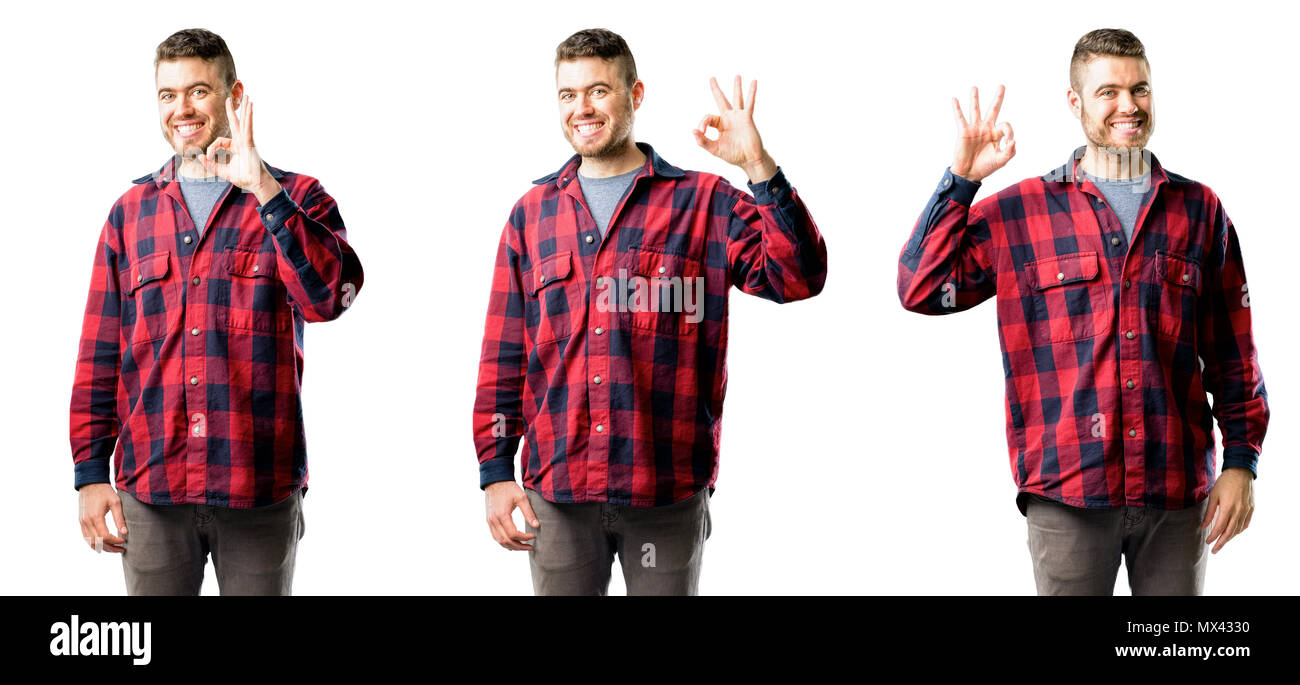 Young man doing ok sign with hand, approve gesture isolated over white ...