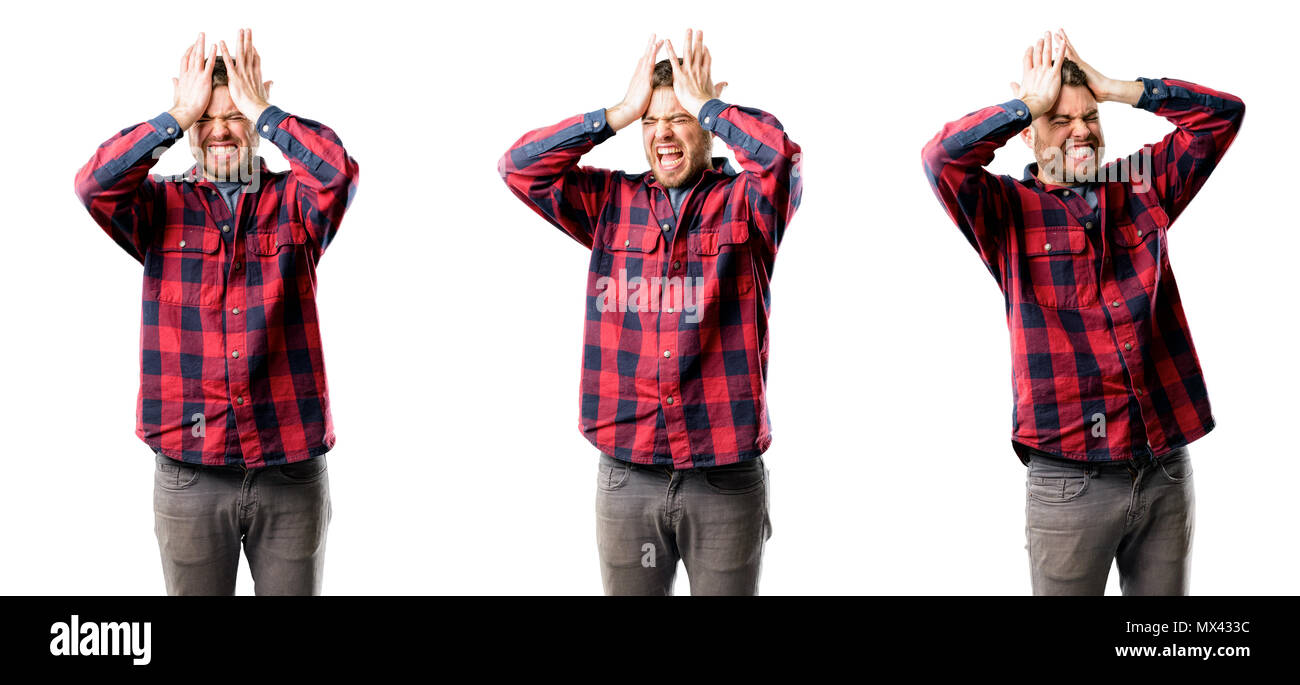 Young man terrified and nervous expressing anxiety and panic gesture ...