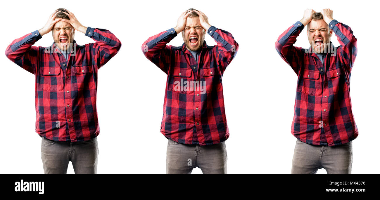 Young man stressful keeping hands on head, terrified in panic, shouting ...