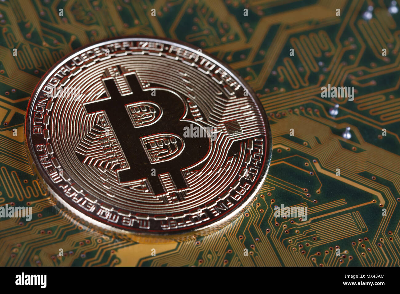 Bitcoin on printed circuit board Stock Photo - Alamy